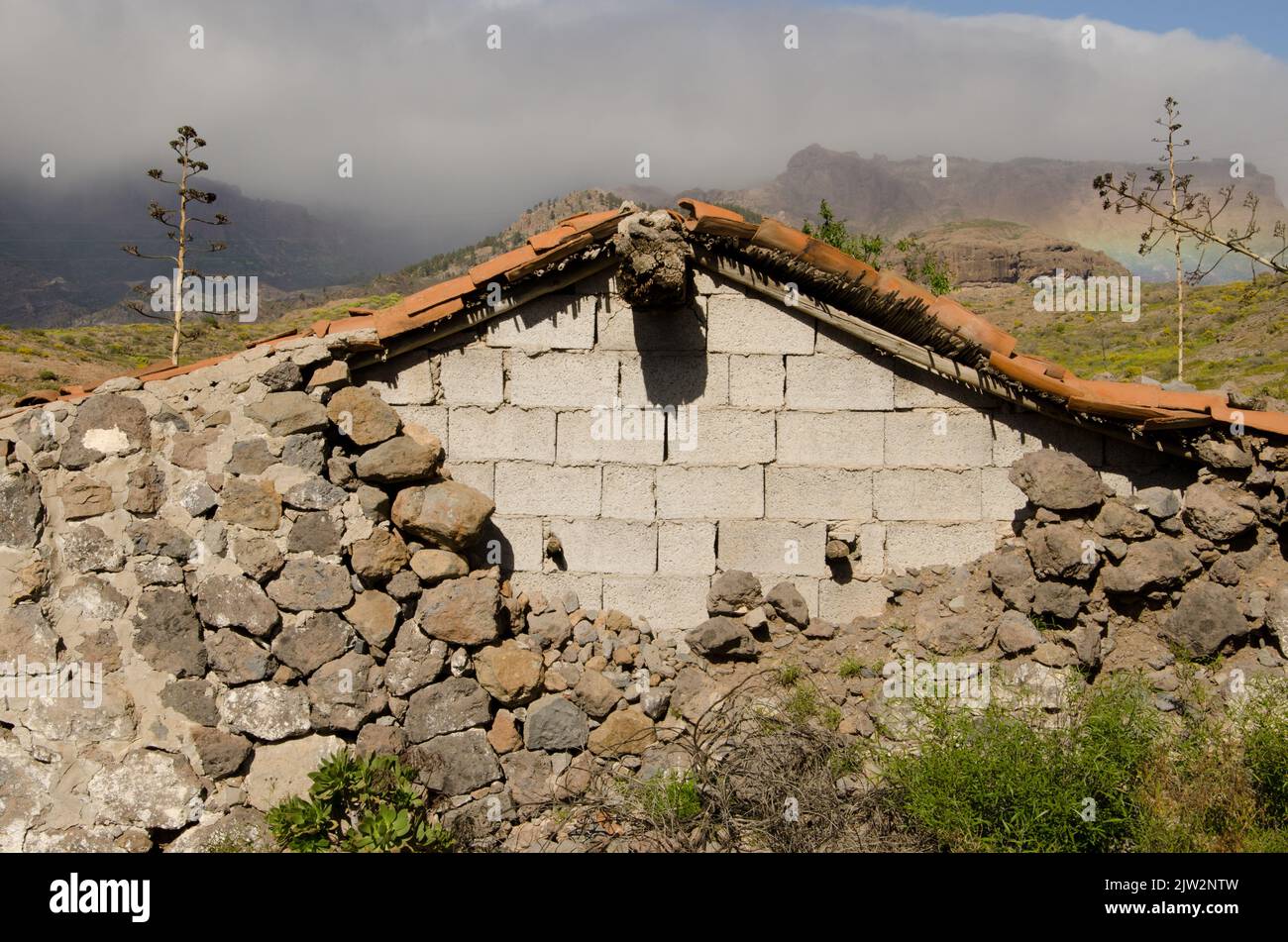 House with one block wall and one collapsed stone wall. San Bartolome ...
