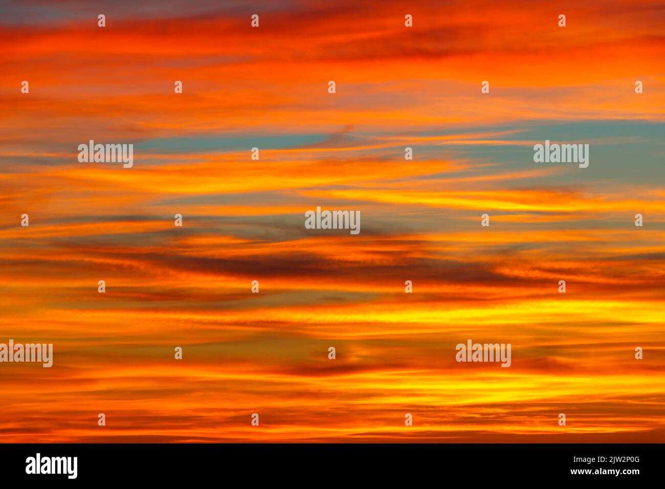 The setting sun lighting up the horizon Stock Photo - Alamy