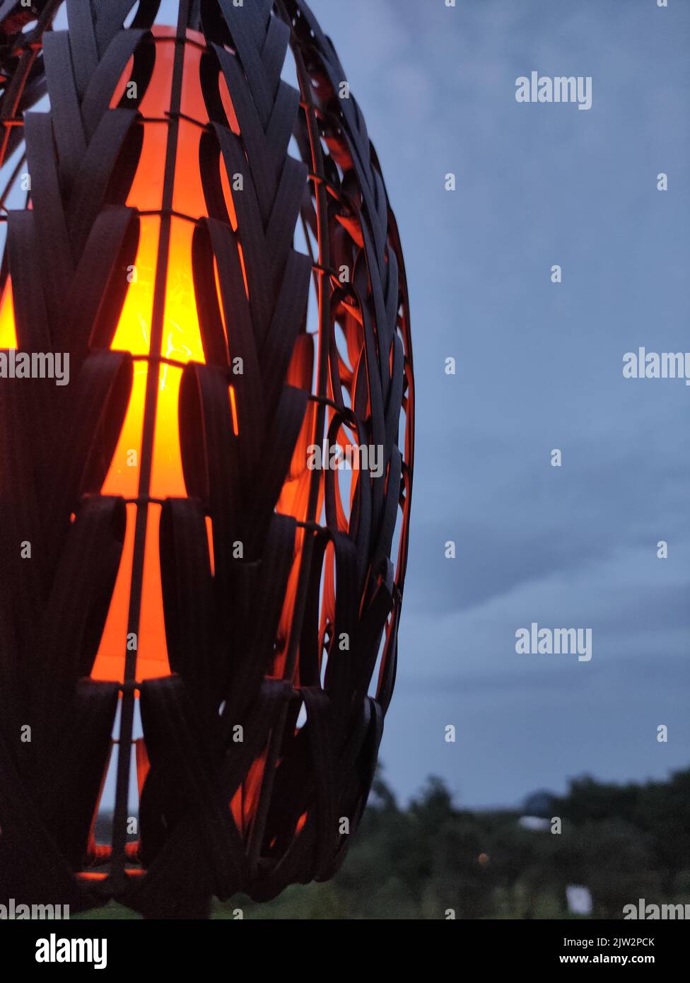 A vertical closeup of a lighting lantern placed outdoors Stock Photo ...