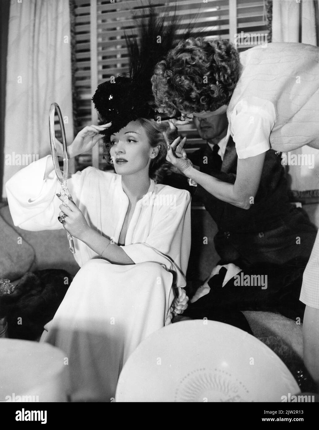 MARLENE DIETRICH on set candid with likely JOHN FREDERICS (behind ...