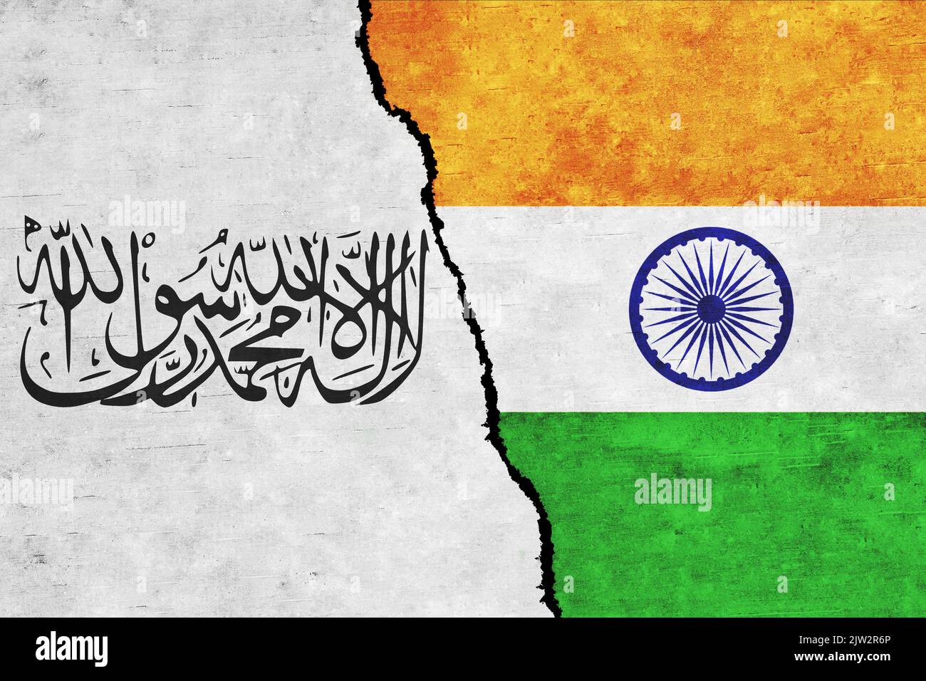India and Taliban painted flags on a wall with a crack. India and ...