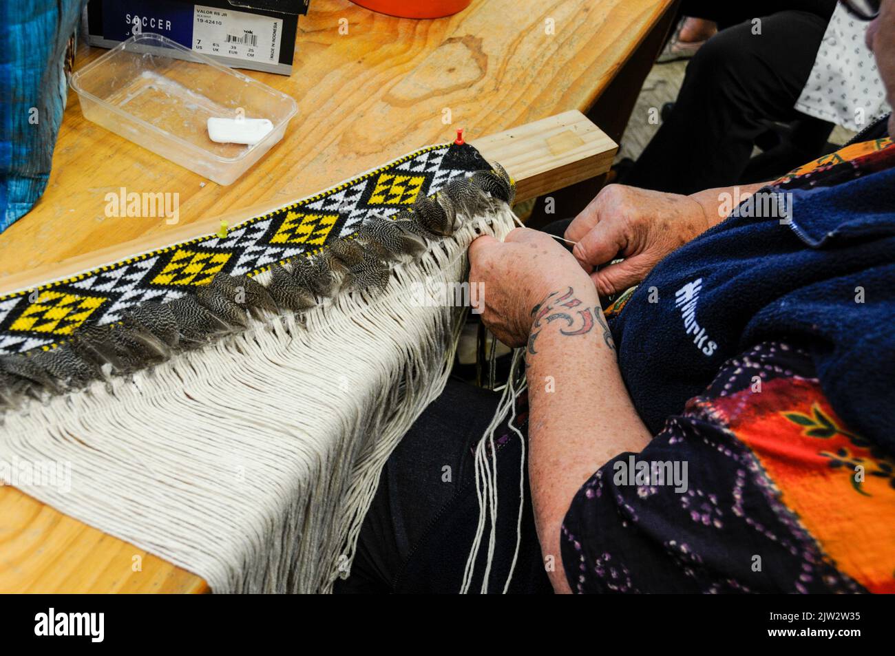 Hand-weaving Maori clothes using materials from the land at Te Puia ...