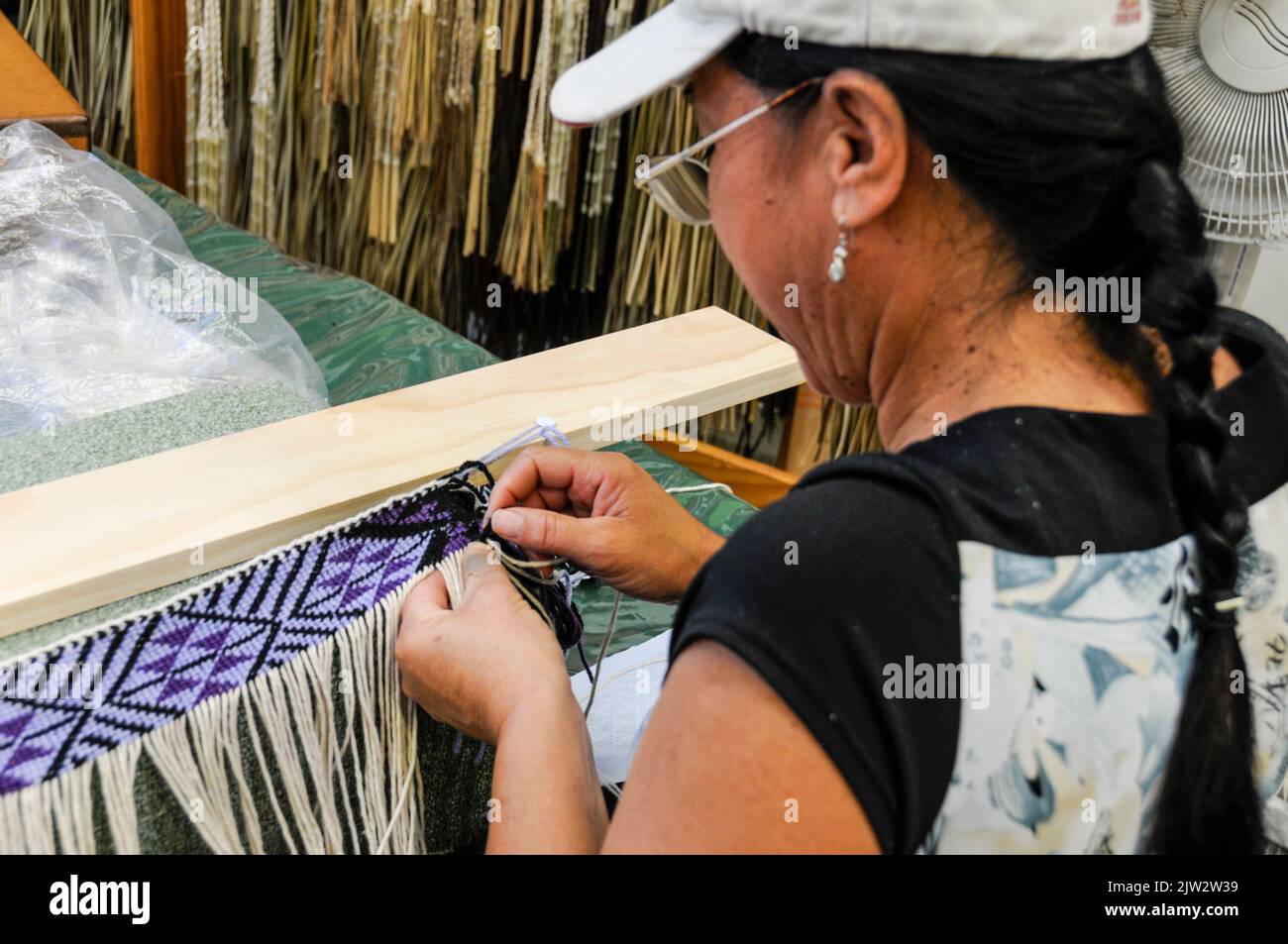 Hand-weaving Maori clothes using materials from the land at Te Puia ...