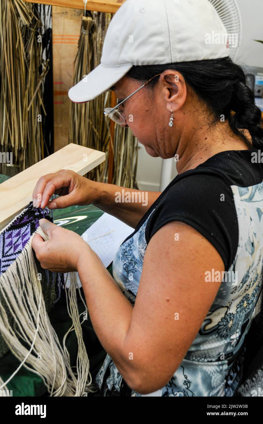 Hand-weaving Maori clothes using materials from the land at Te Puia ...