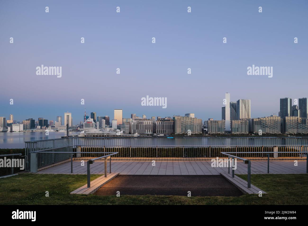 A low-angle view of a modern building in Tokyo, Japan at sunrise Stock ...