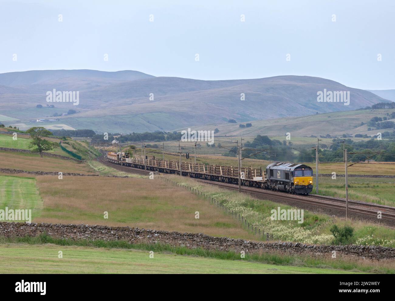 DRS class 66 locomotive on Shap bank, West Coast Main line, Cumbria ...