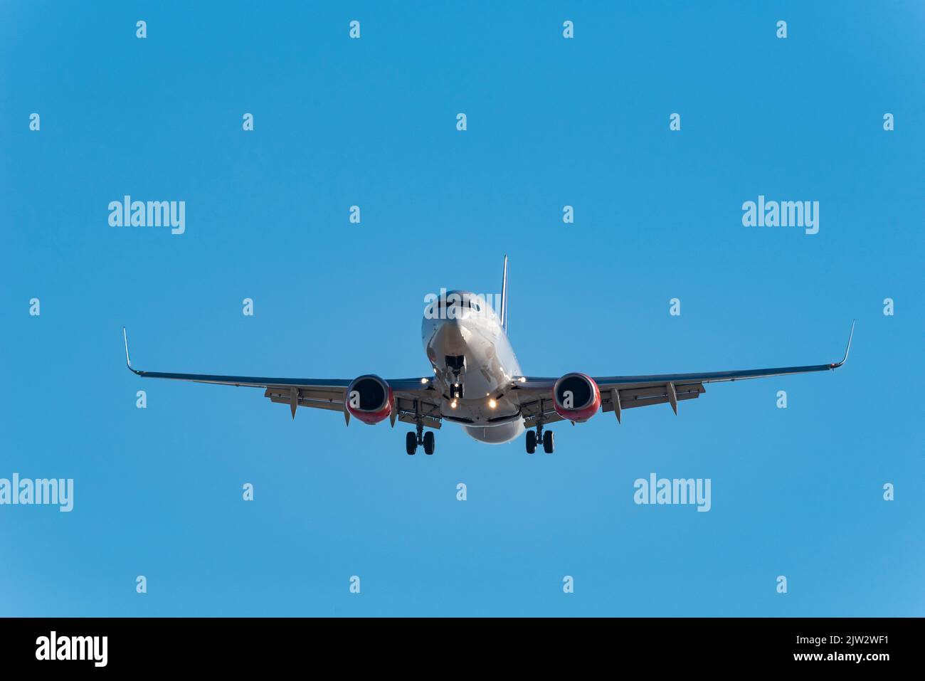 Passenger airplane on approach to the airport landing - stock photo ...