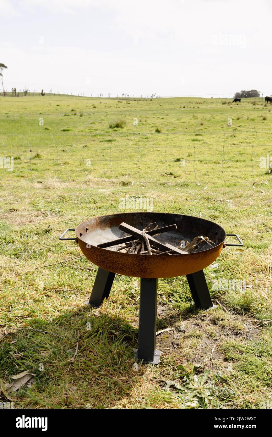 A fire pit with wood and kindling ready to be lit on a farm Stock Photo ...