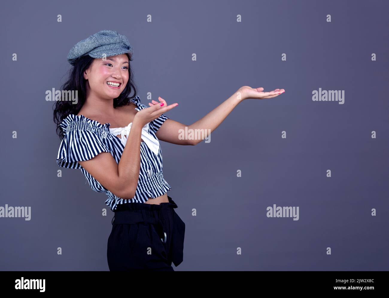 pretty asian woman pointing to her isolated one in the background Stock ...