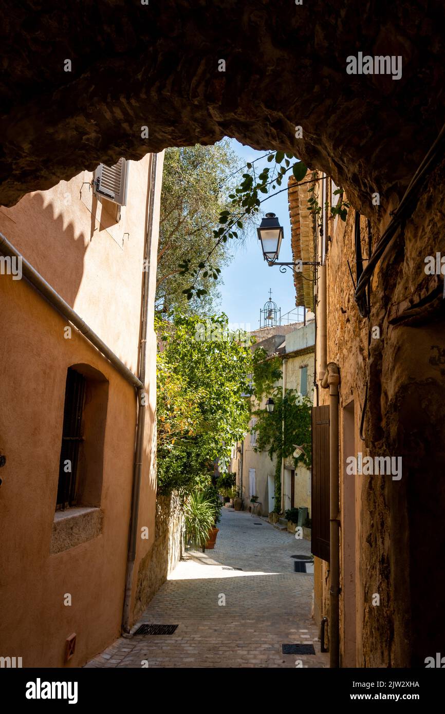 Old narrow alley in the village of La Cadière-d'Azur, France, commune ...