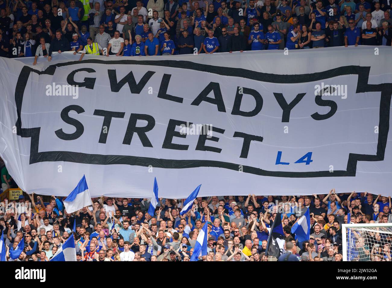 Everton fans in the stands hold up a Gwladys Street banner ahead of the ...