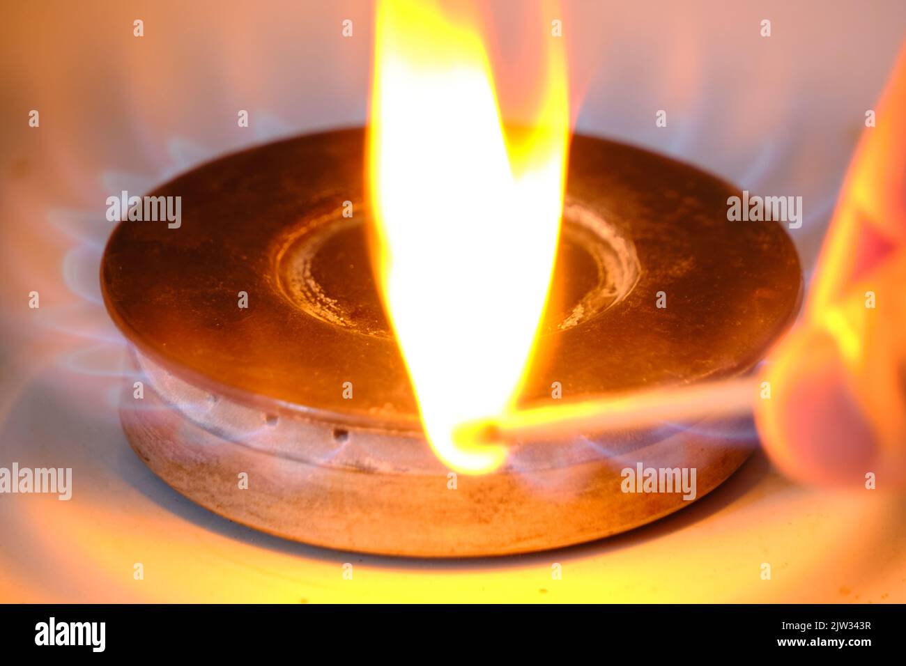 Burning match against background blue flame burning burner Stock Photo ...