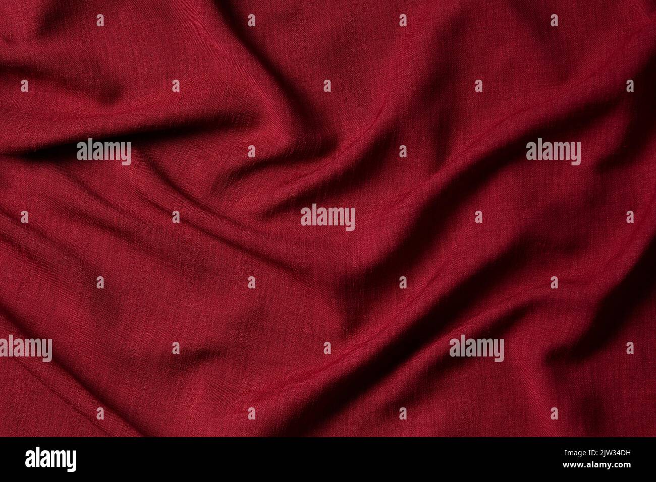Red crumpled linen fabric texture background. Natural linen organic eco ...