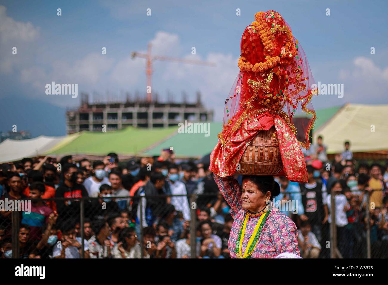 Kathmandu, Bagmati, Nepal. 3rd Sep, 2022. A woman carries Biruda (five ...