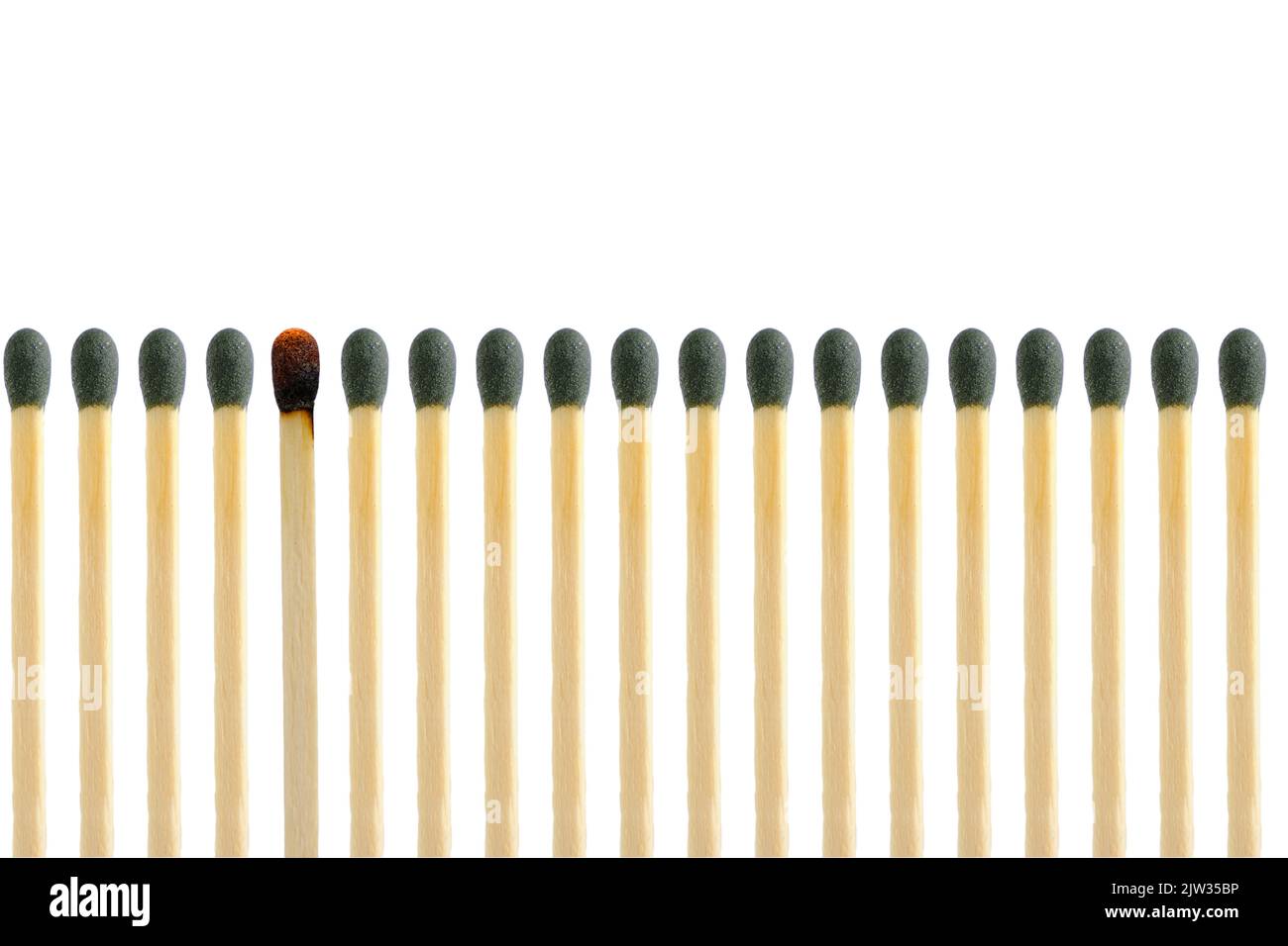 Row of identical matches with green heads and one different from all ...