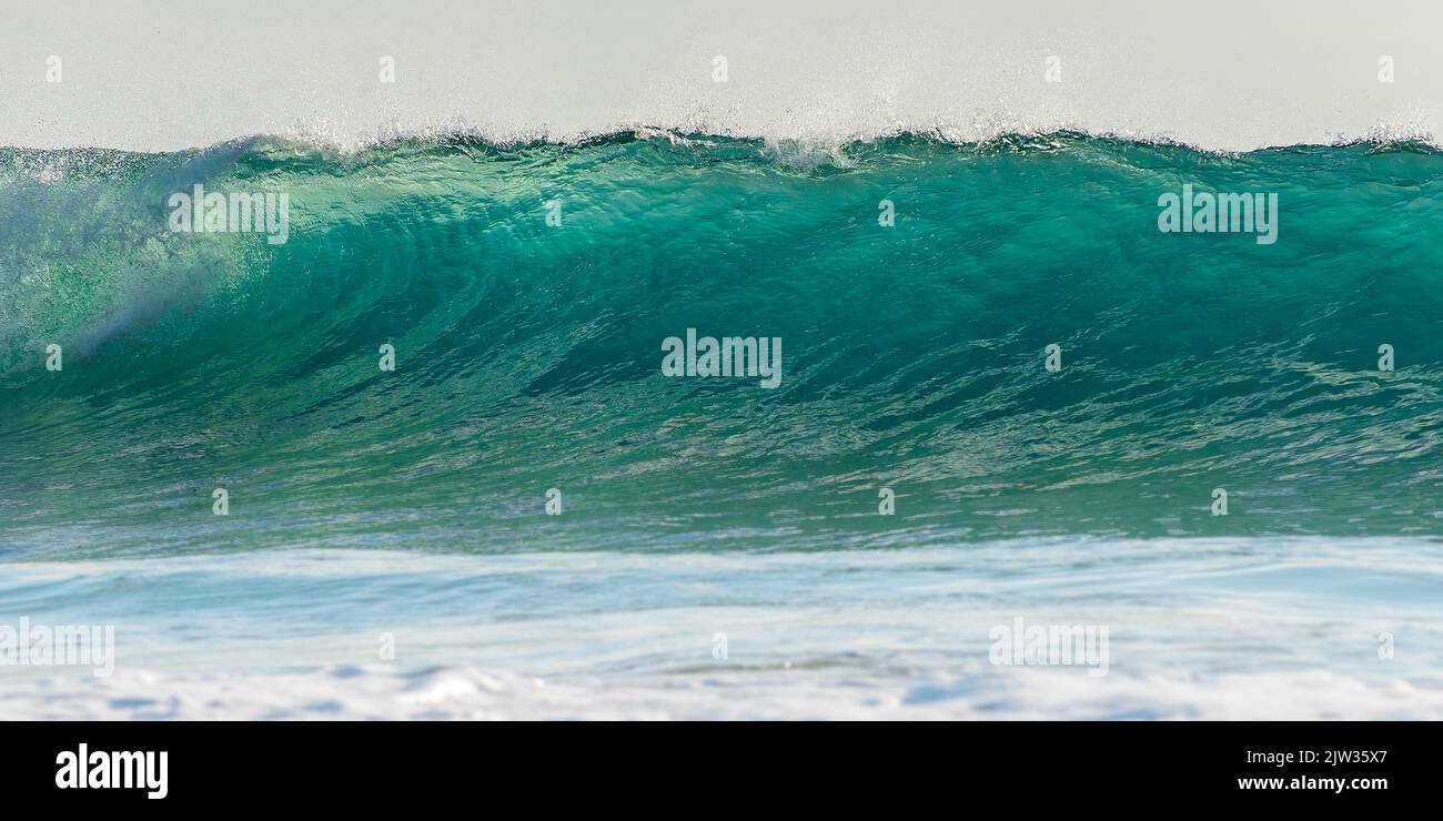 Moody waves crashing into shore at Praa sands beach Cornwall Stock Photo - Alamy