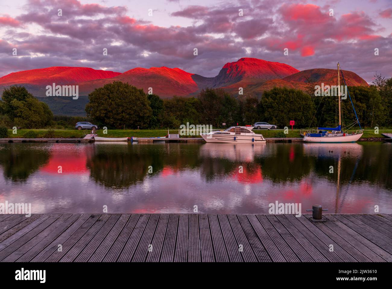 Looking across the Caledonian Canal at sunset towards Ben Nevis, the ...