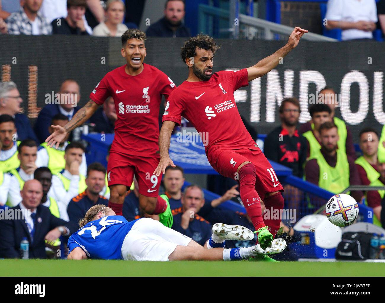 Everton's Tom Davies challenges Liverpool's Mohamed Salah during the ...