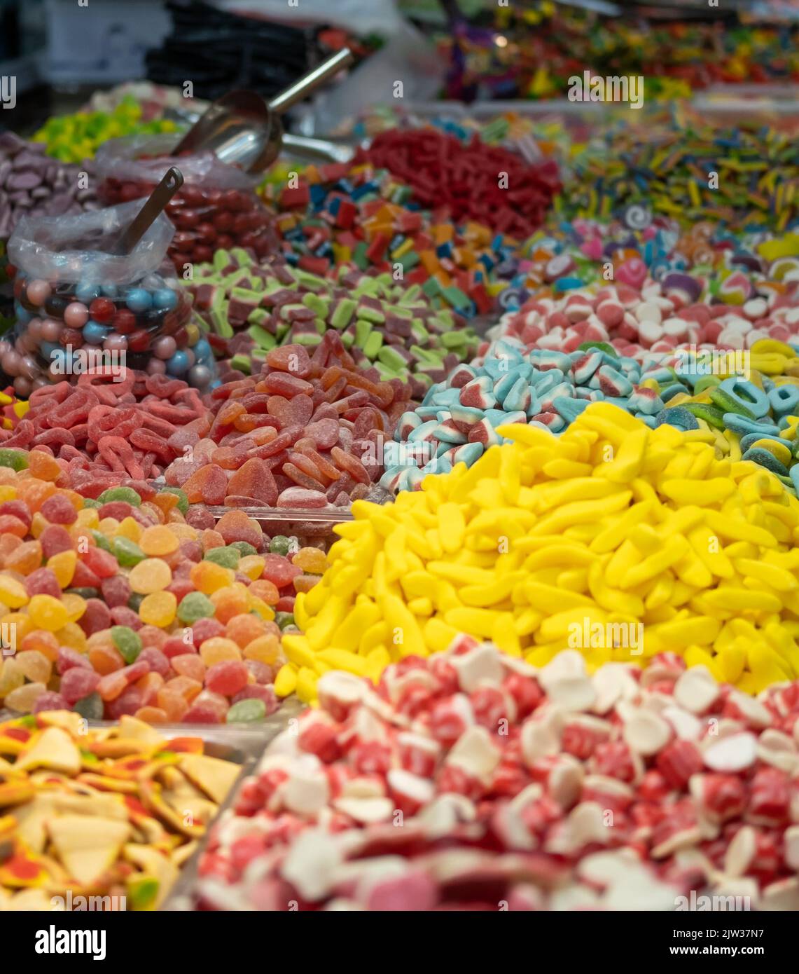 photo of different mixed delicious colorful sweet sugar and candy in an ...