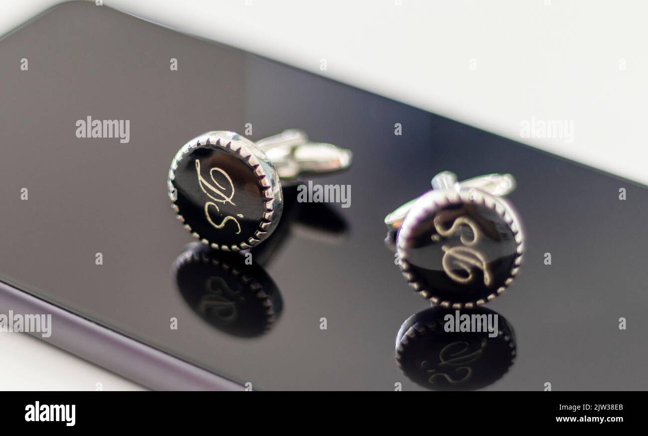 Close up shot of a silver cufflinks with letters D and S Stock Photo ...