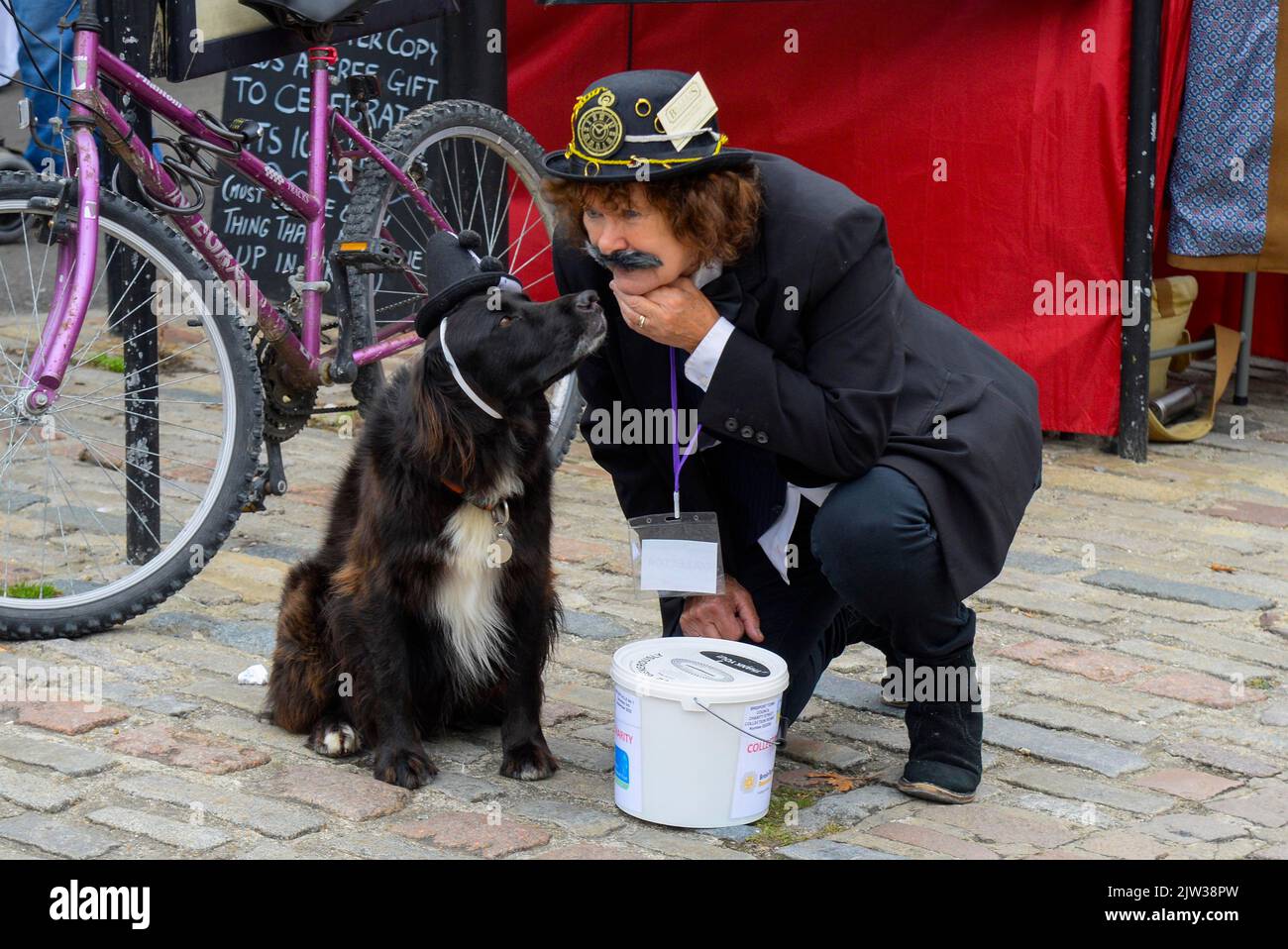 Bridport, Dorset, UK. 3rd September 2022. Festival-goer and her dog at ...