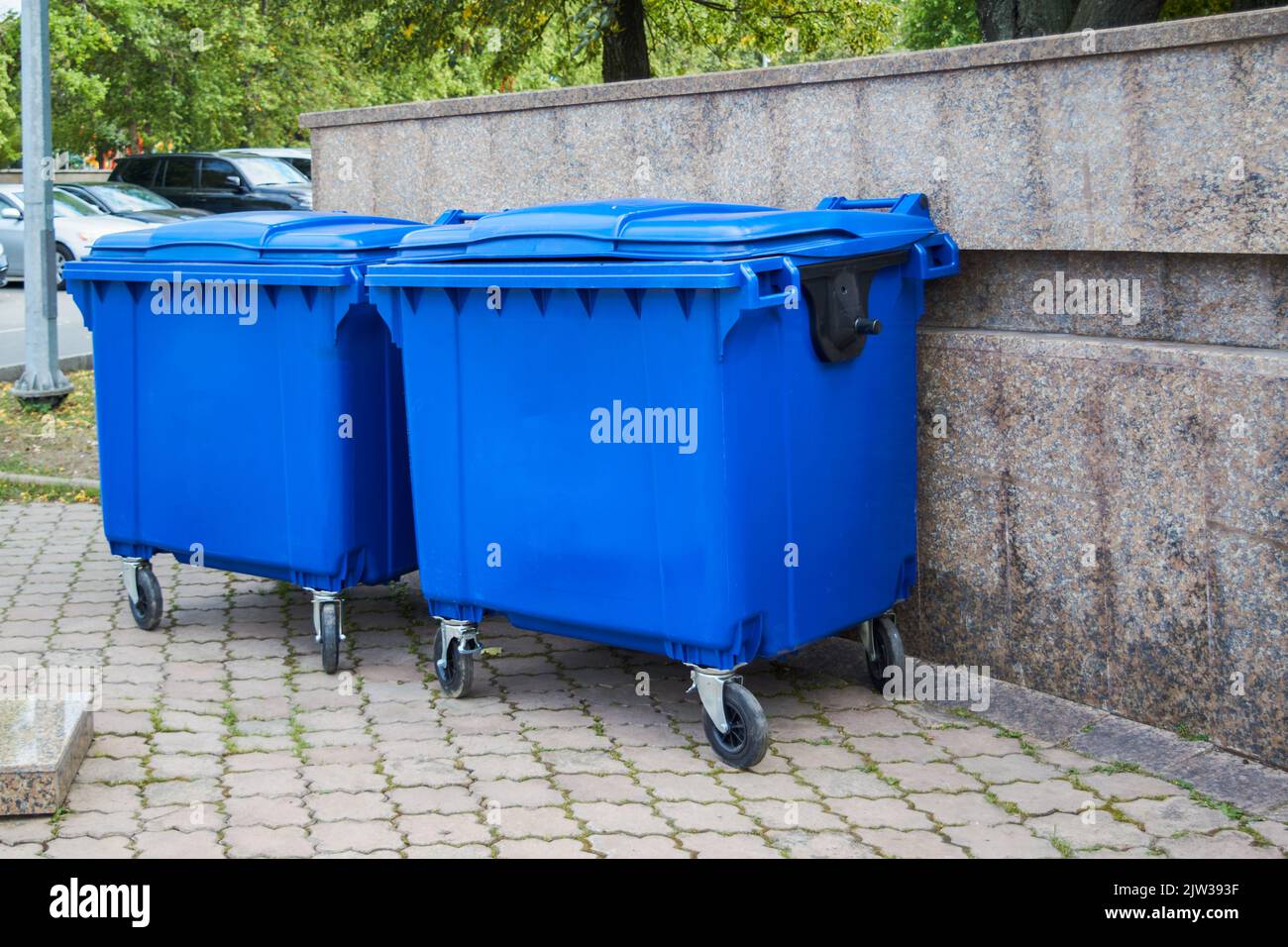 Blue plastic trash recycling containers. Blue containers for collecting ...