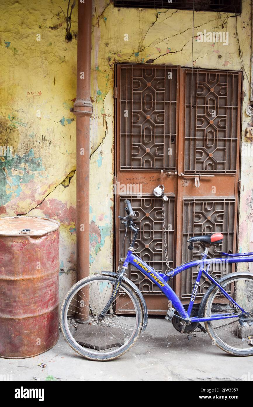 A blue Bicycle with a metallic can in India Stock Photo - Alamy