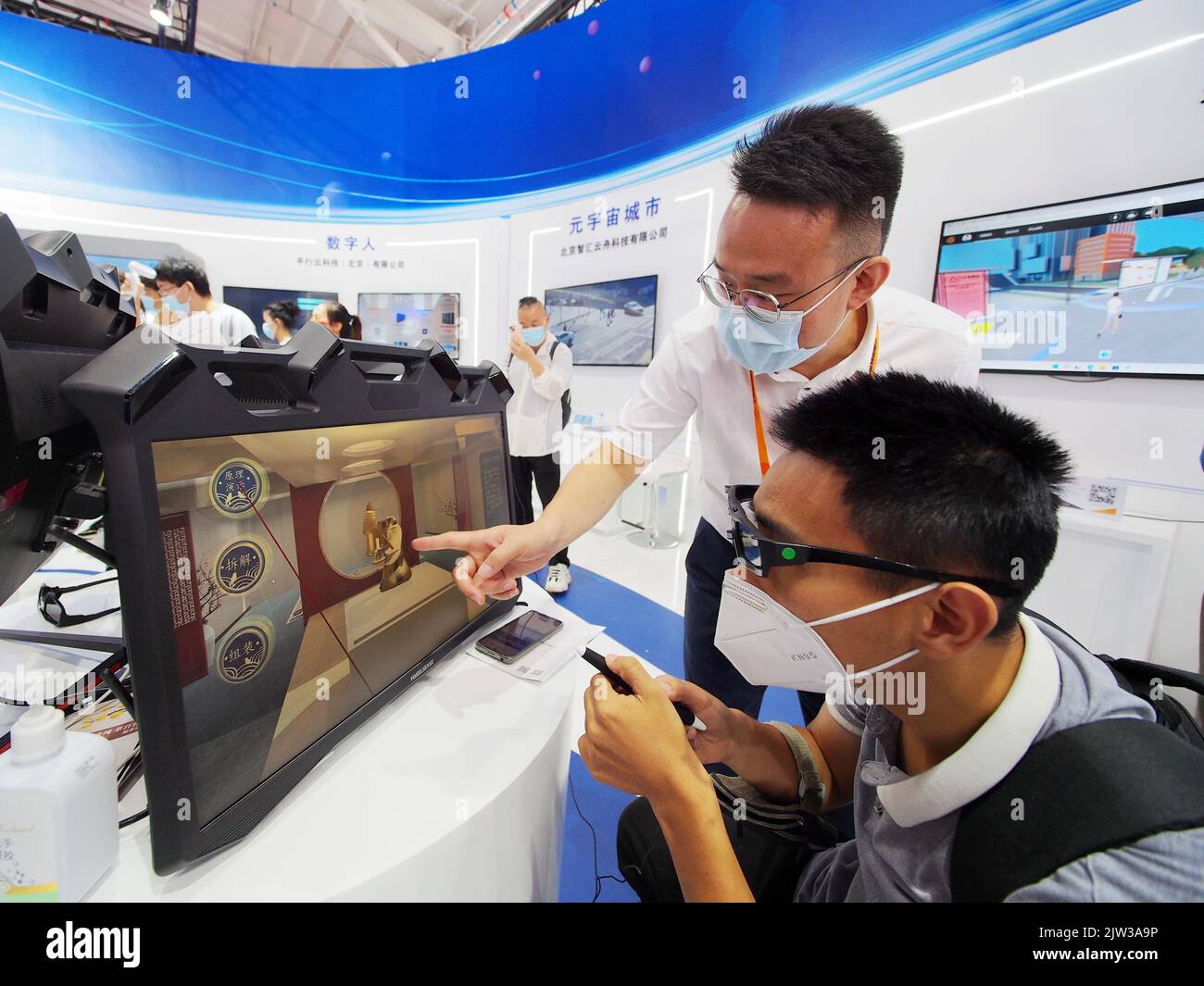 BEIJING, CHINA - SEPTEMBER 3, 2022 - Visitors disassemble and assemble ...