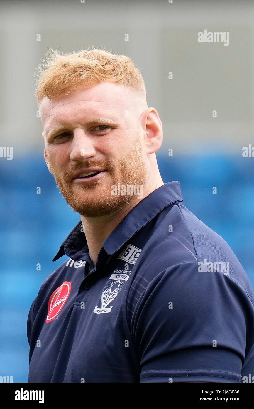 Joe Bullock #15 of Warrington Wolves inspects the pitch before the ...