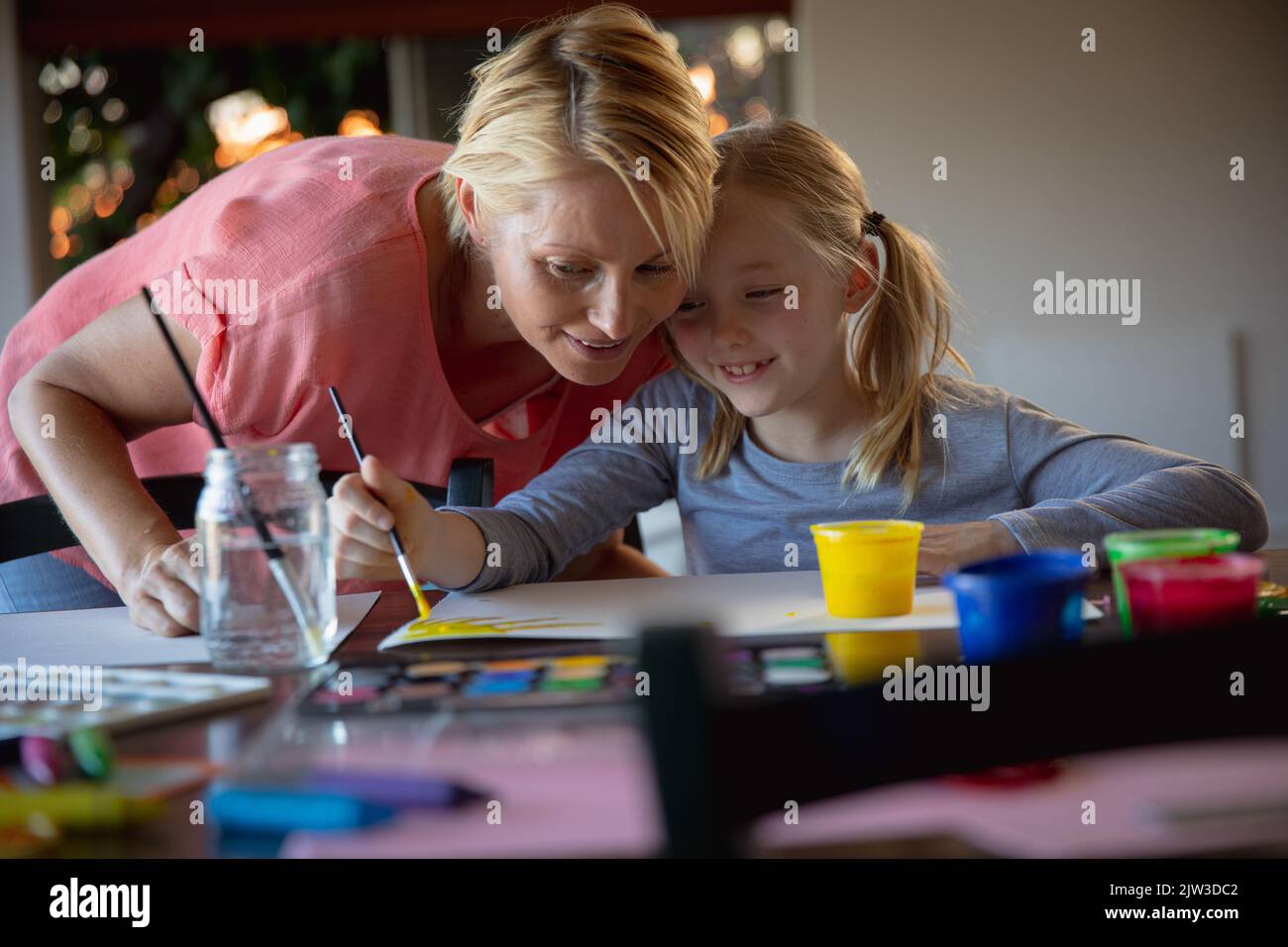 Mother and daughter painting together Stock Photo - Alamy