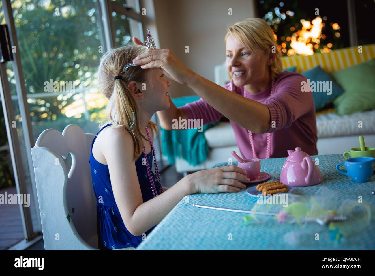 Mother and daughter taking tea together Stock Photo - Alamy