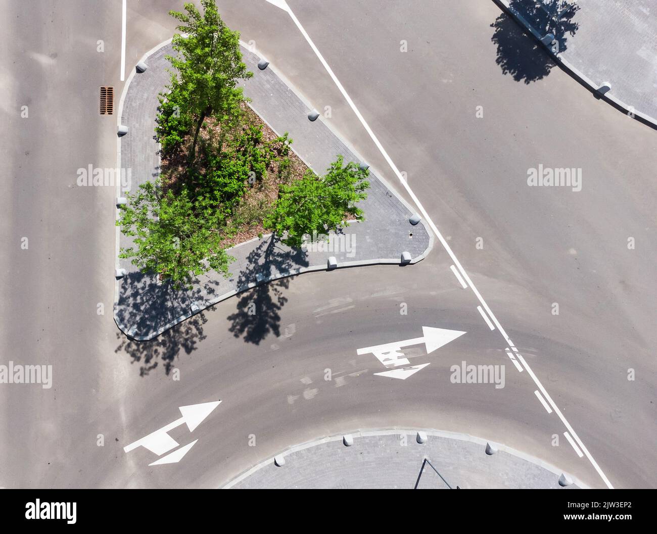 aerial top view of street with parking lot near new residential housing ...