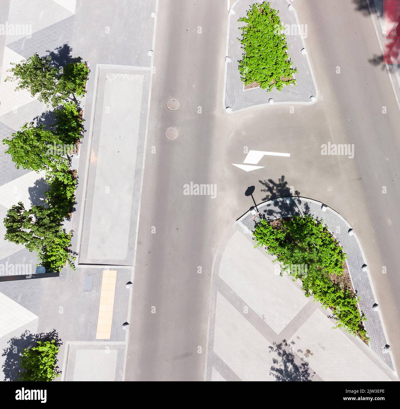 aerial top view of street with parking lot near new residential housing ...