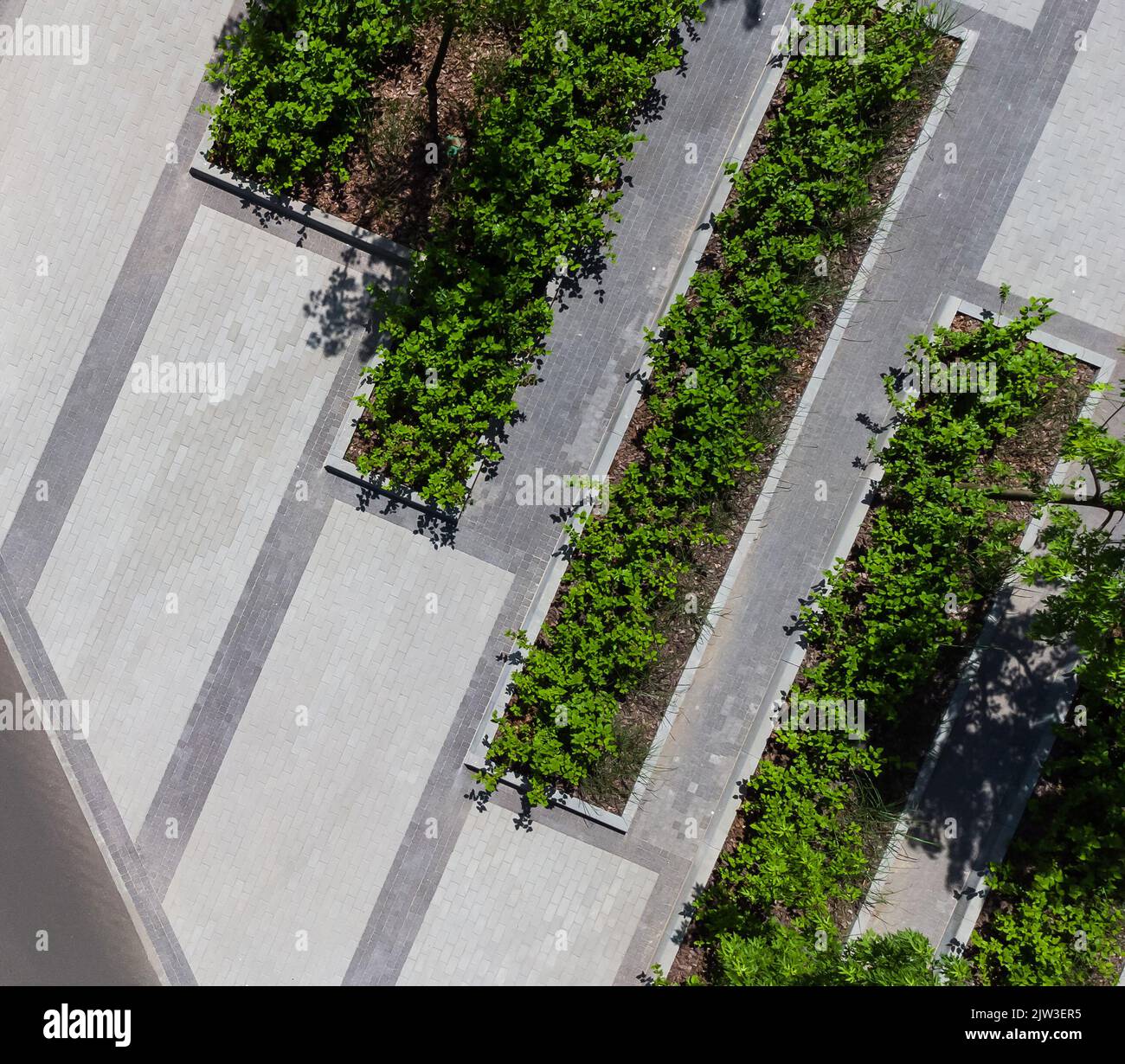 aerial top view of street with parking lot near new residential housing ...