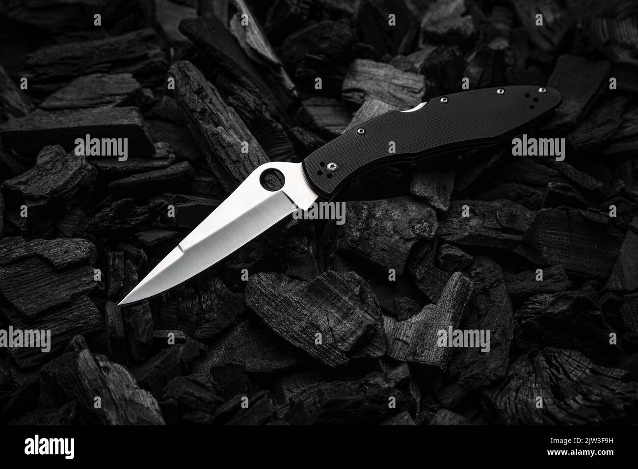 Modern knife with a silver blade. Hunting, military folding knife on ...