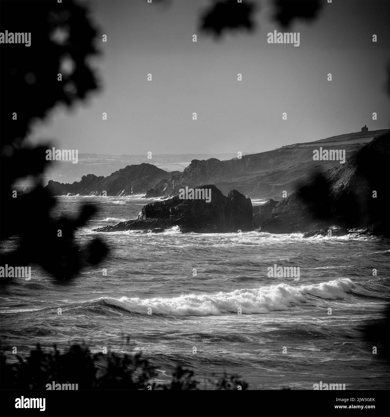 Moody waves crashing into shore at Praa sands beach Cornwall Stock ...