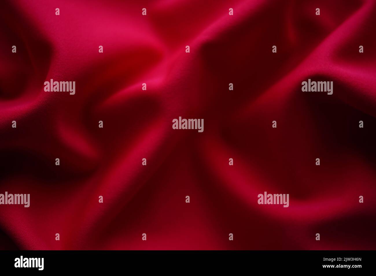 Closeup wrinkled red jersey, soft fabric background Stock Photo - Alamy