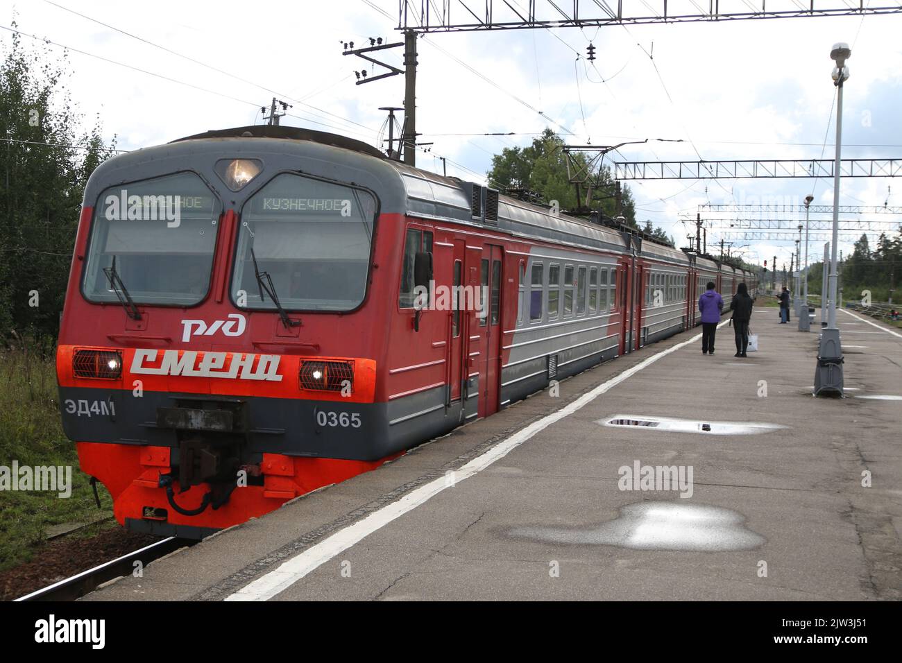 Passengers seen close to a Russian Railways train at the Sosnovo ...