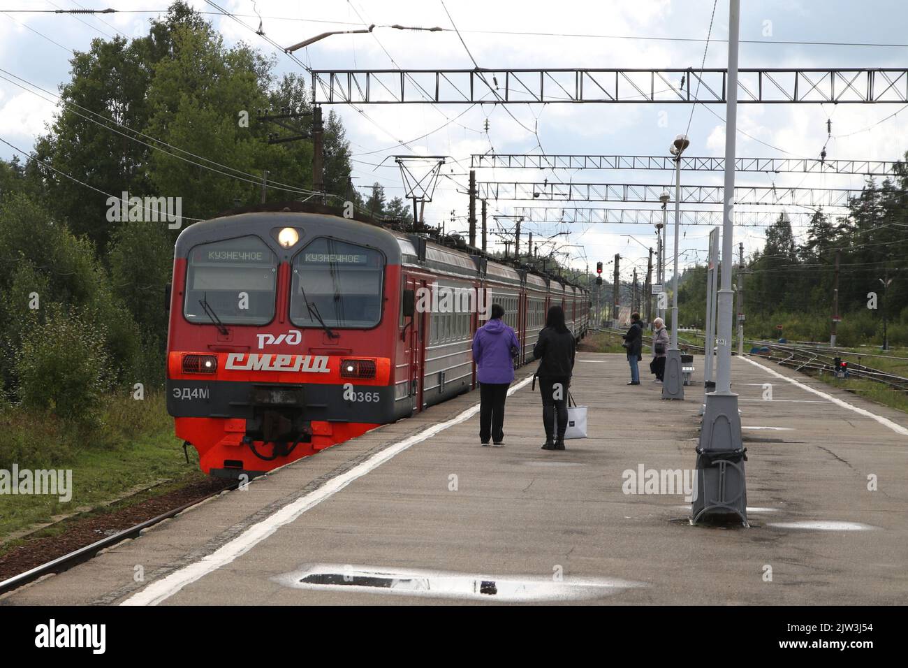 Passengers board off a Russian Railways train at the Sosnovo railway ...