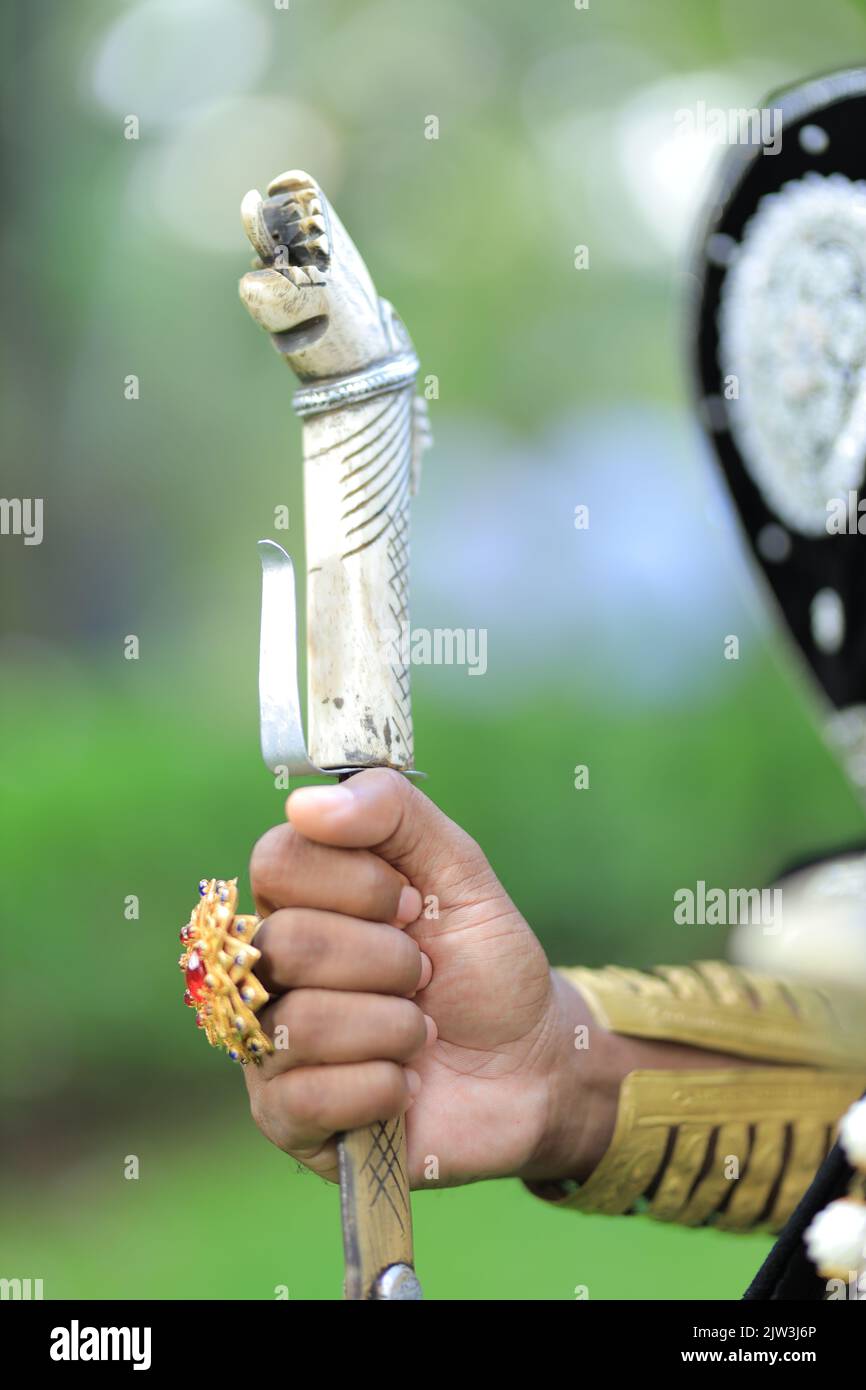 Ancient sword on hand Stock Photo - Alamy