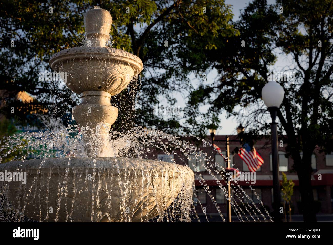 The morning sun warms a fountain in the downtown area of Manitowoc ...