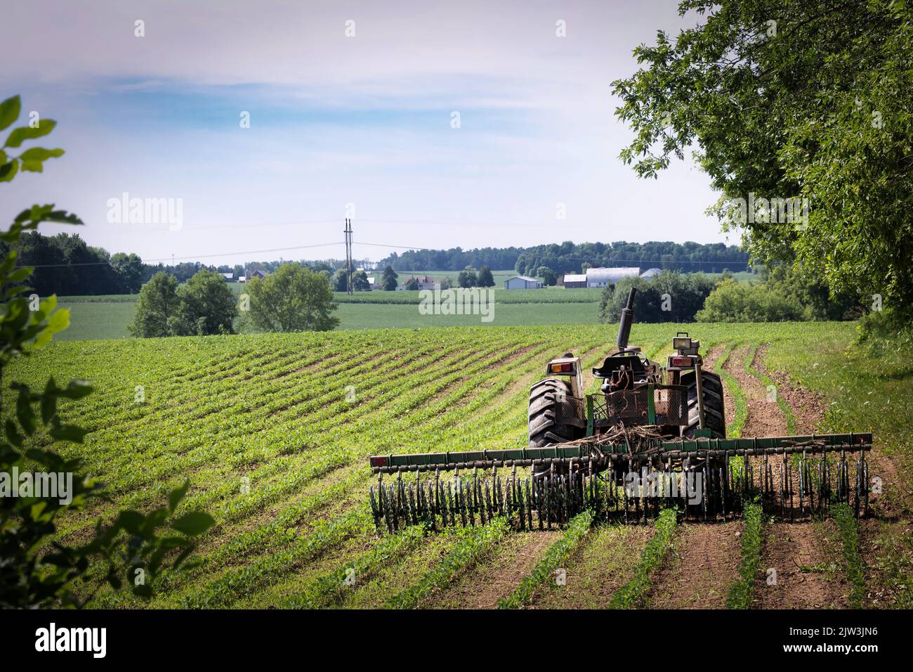 A tractor sits idle on a farm in Kossuth, near Manitowoc, Wisconsin ...