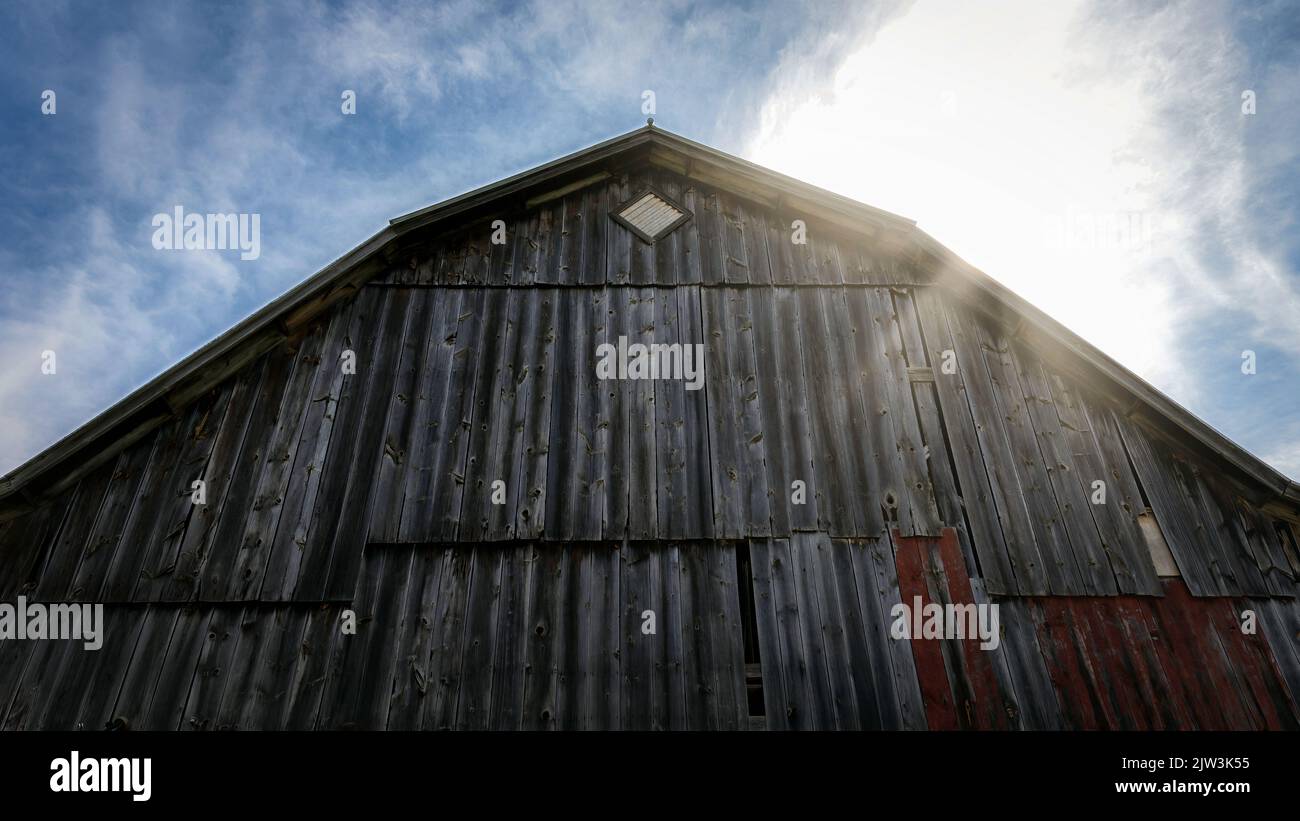 The side of an old barn, weathered and worn, stands at Kossuth, an area ...