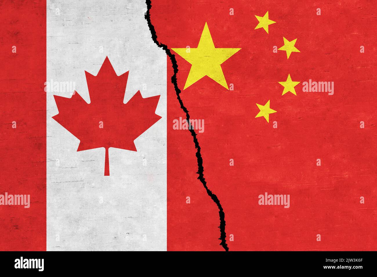 China and Canada painted flags on a wall with a crack. China and Canada ...
