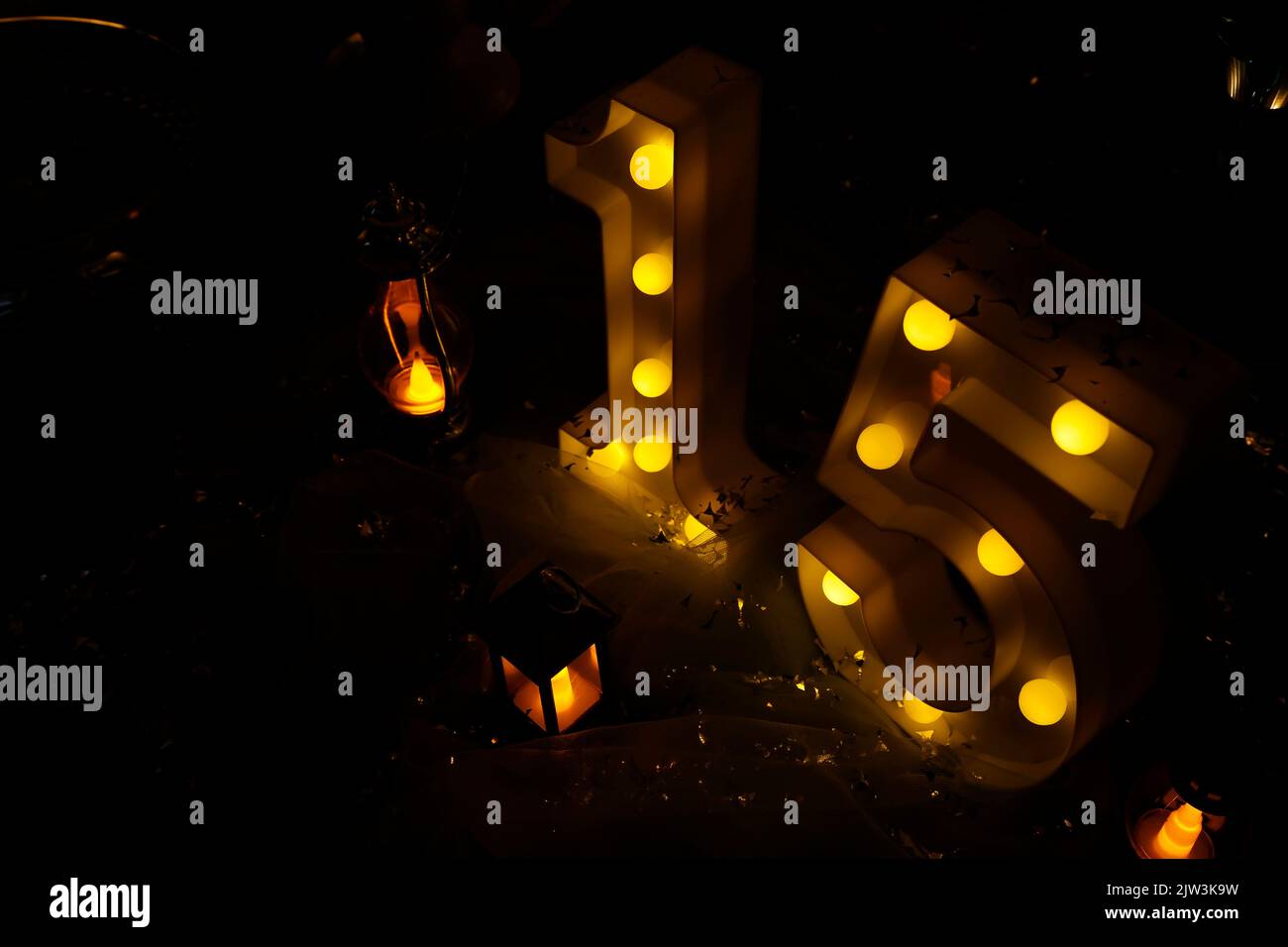 number fifteen with lights at 15th birthday party - top view - light ...