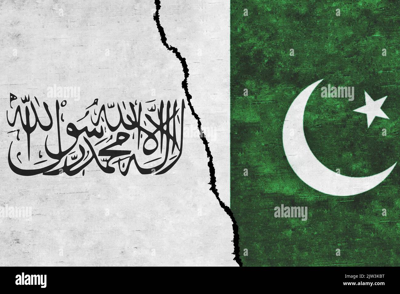 Pakistan and Taliban painted flags on a wall with a crack. Pakistan and ...