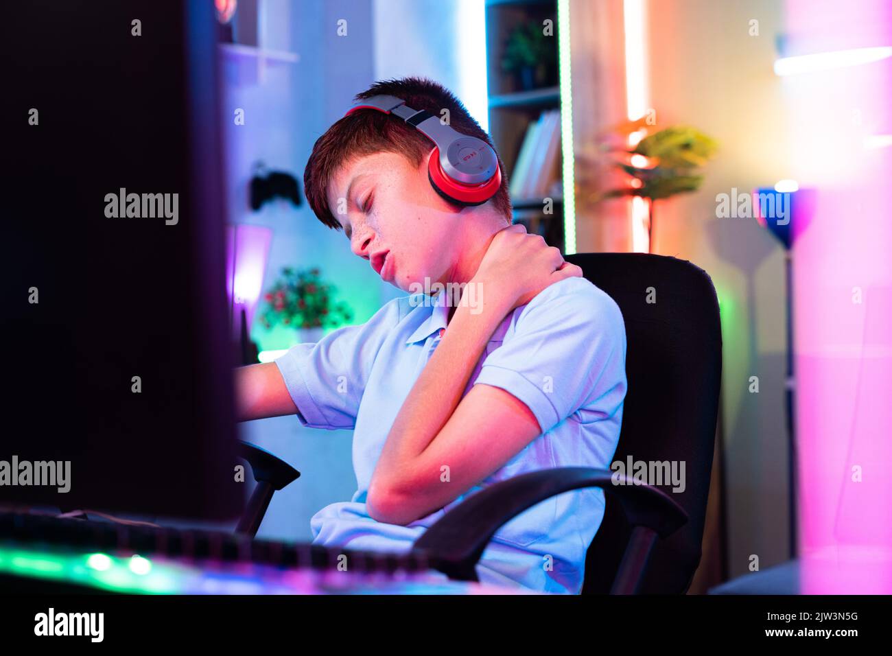 exhausted young teenager kid suffering from joint paing due to over ...