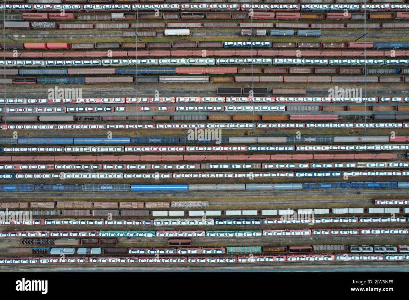 Railway station and freight train wagons with SKODA cars and different ...