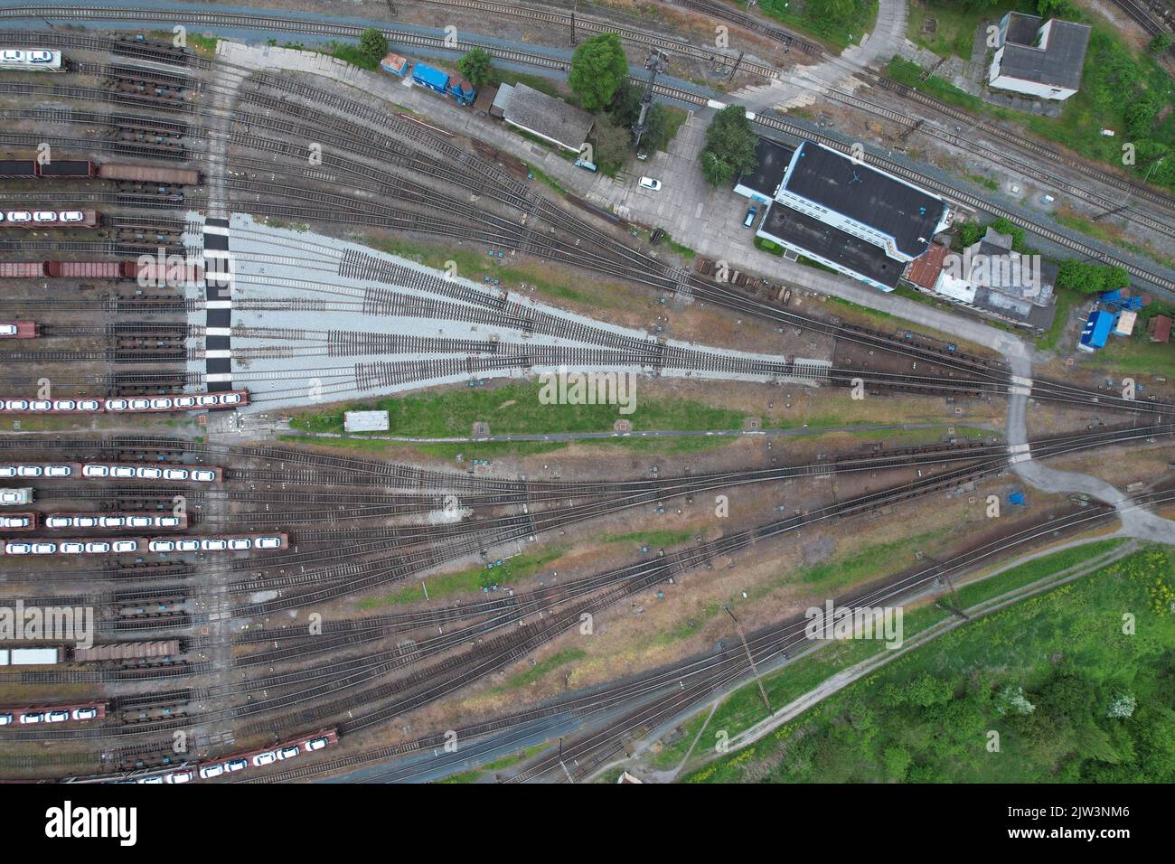 Railway station and freight train wagons with SKODA cars and different ...