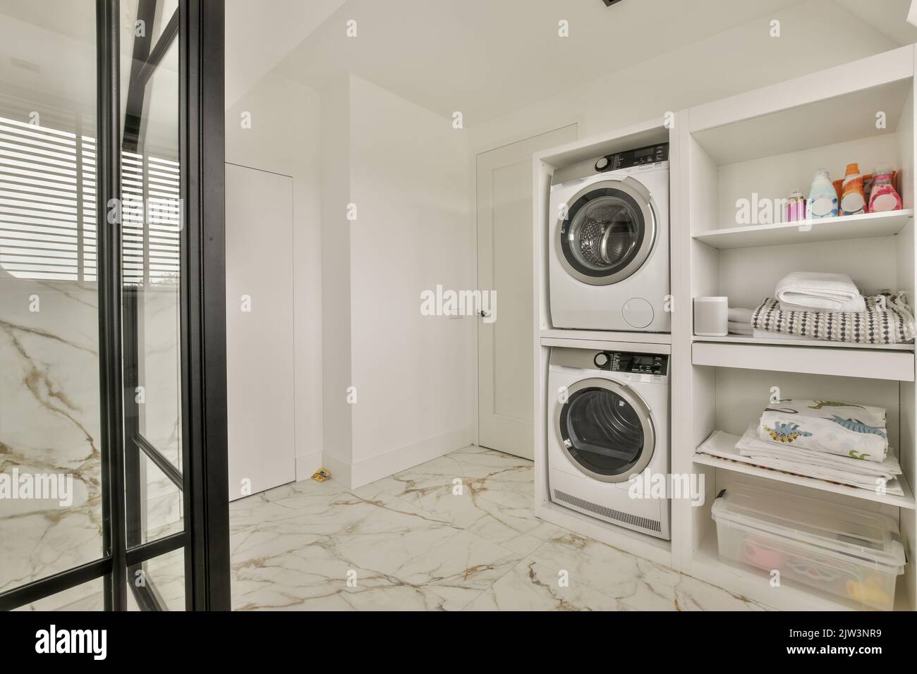 Shower and free-standing bathroom in light bathroom with washing ...